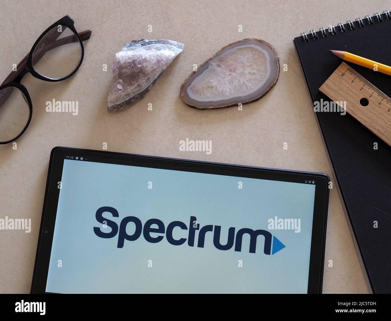 In this photo illustration CVS logo seen displayed on a tablet Stock ...