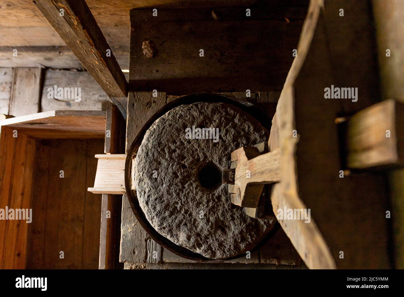 Ancient mill made of stones and wood. Weet grinding machine used in ...