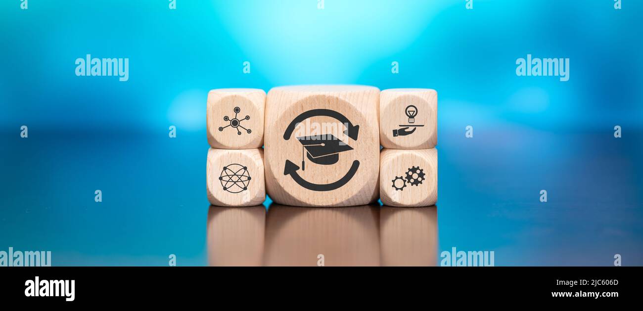 Wooden blocks with symbol of knowledge sharing concept on blue ...