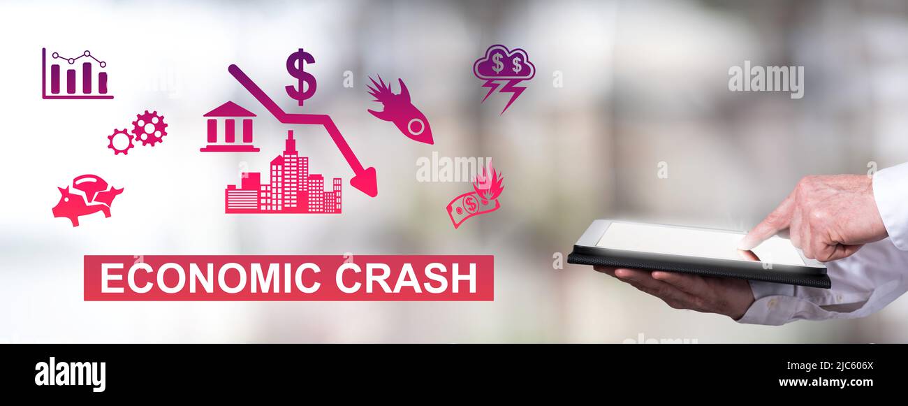 Man using a tablet with economic crash concept Stock Photo - Alamy