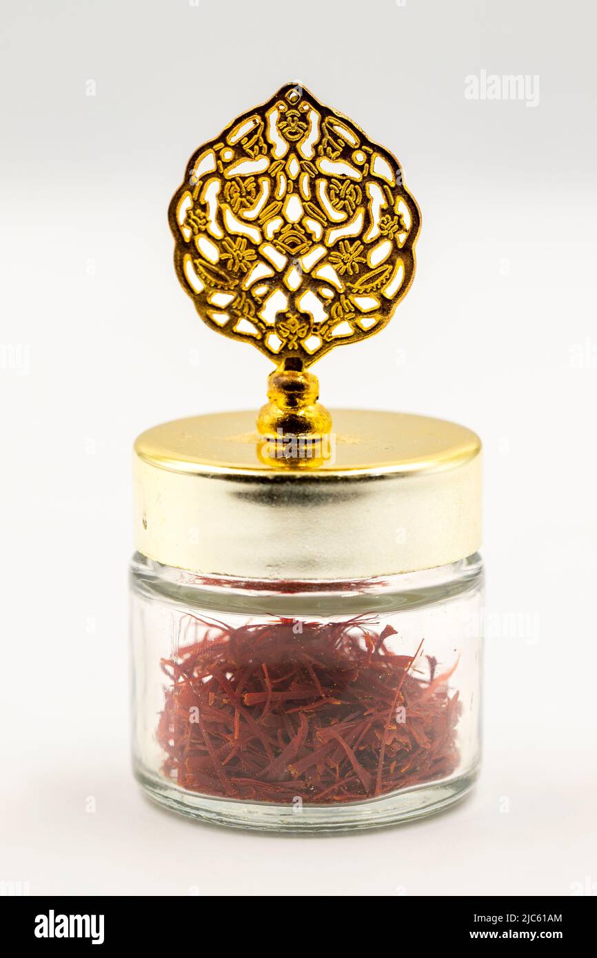 Packaged Iranian saffron in glass bottle on white background. close up ...