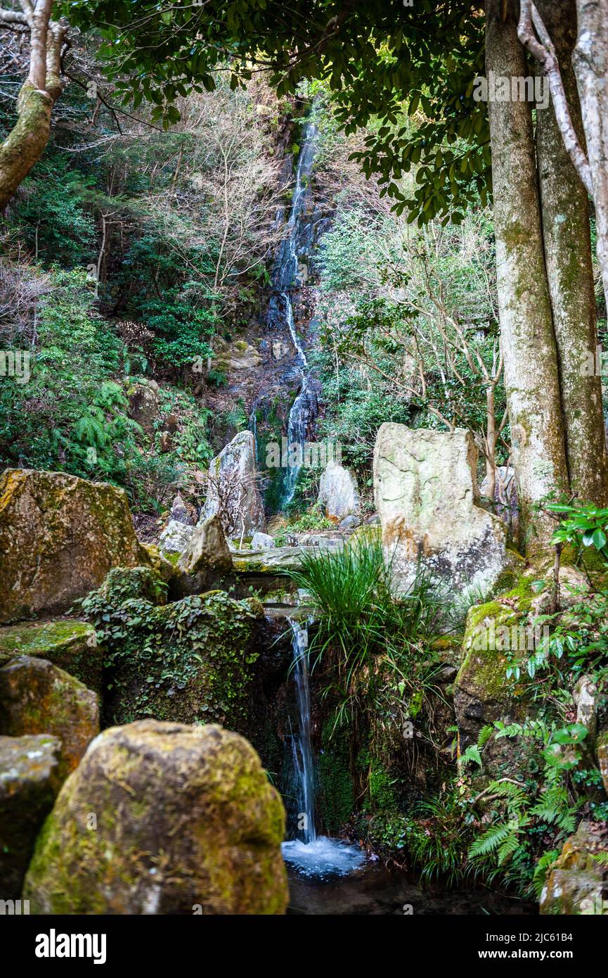 Hiroshima, Japan - January 2, 2020. Tiny waterfall outside the Mitaki ...