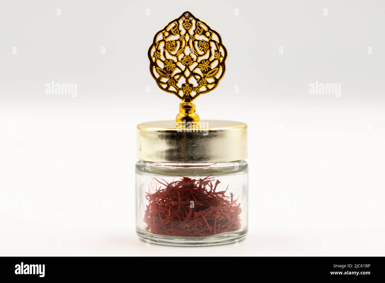 Packaged Iranian saffron in glass bottle on white background. close up ...