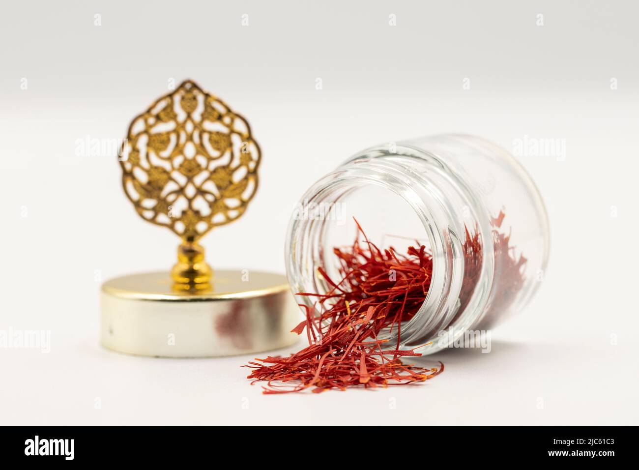 Packaged Iranian saffron in glass bottle on white background. close up ...