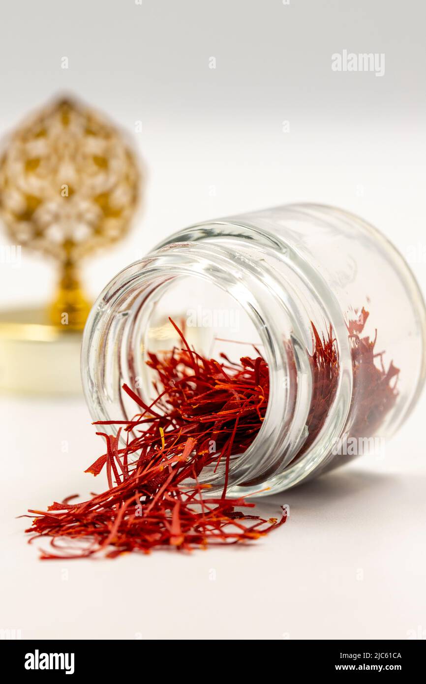 Packaged Iranian saffron in glass bottle on white background. close up ...