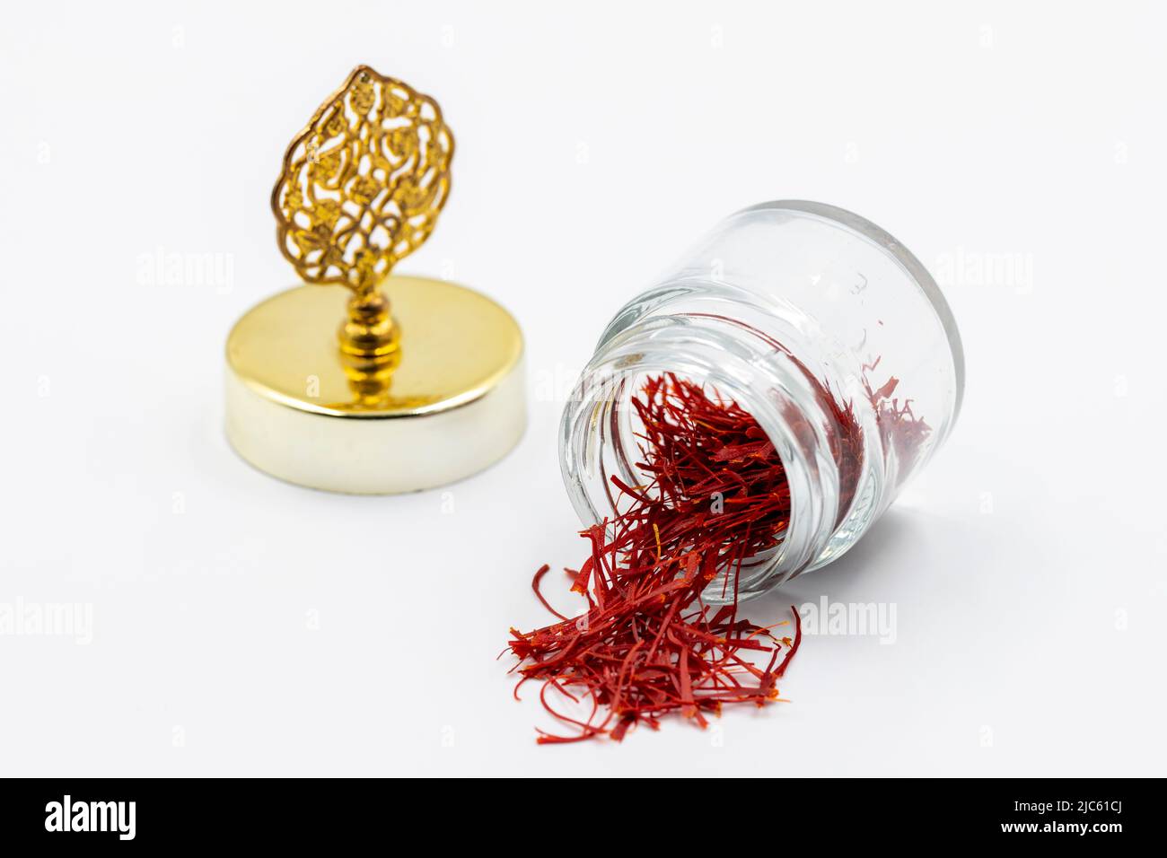 Packaged Iranian saffron in glass bottle on white background. close up ...
