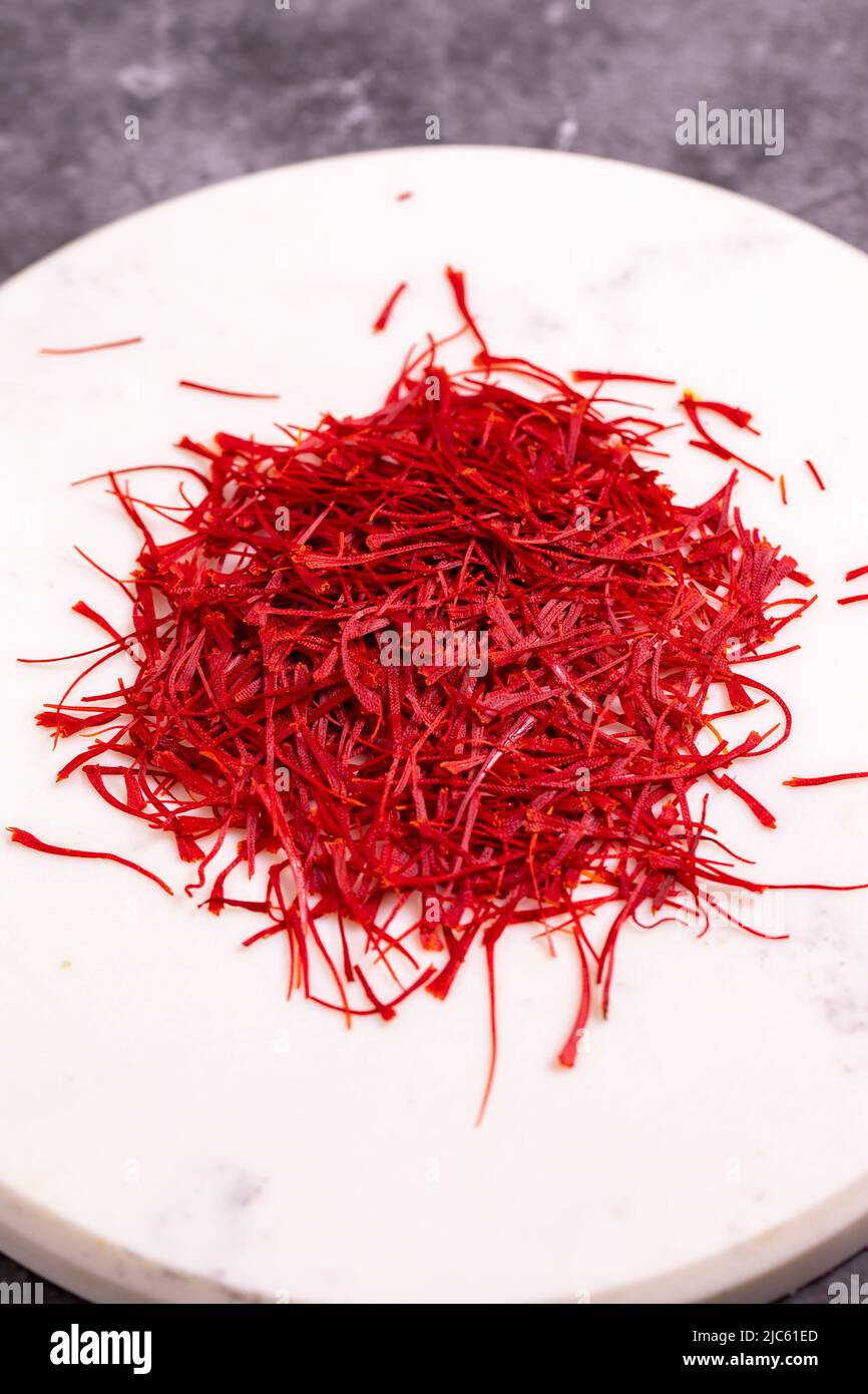 Saffron on a dark background. Close-up. Iranian or Persian saffron ...