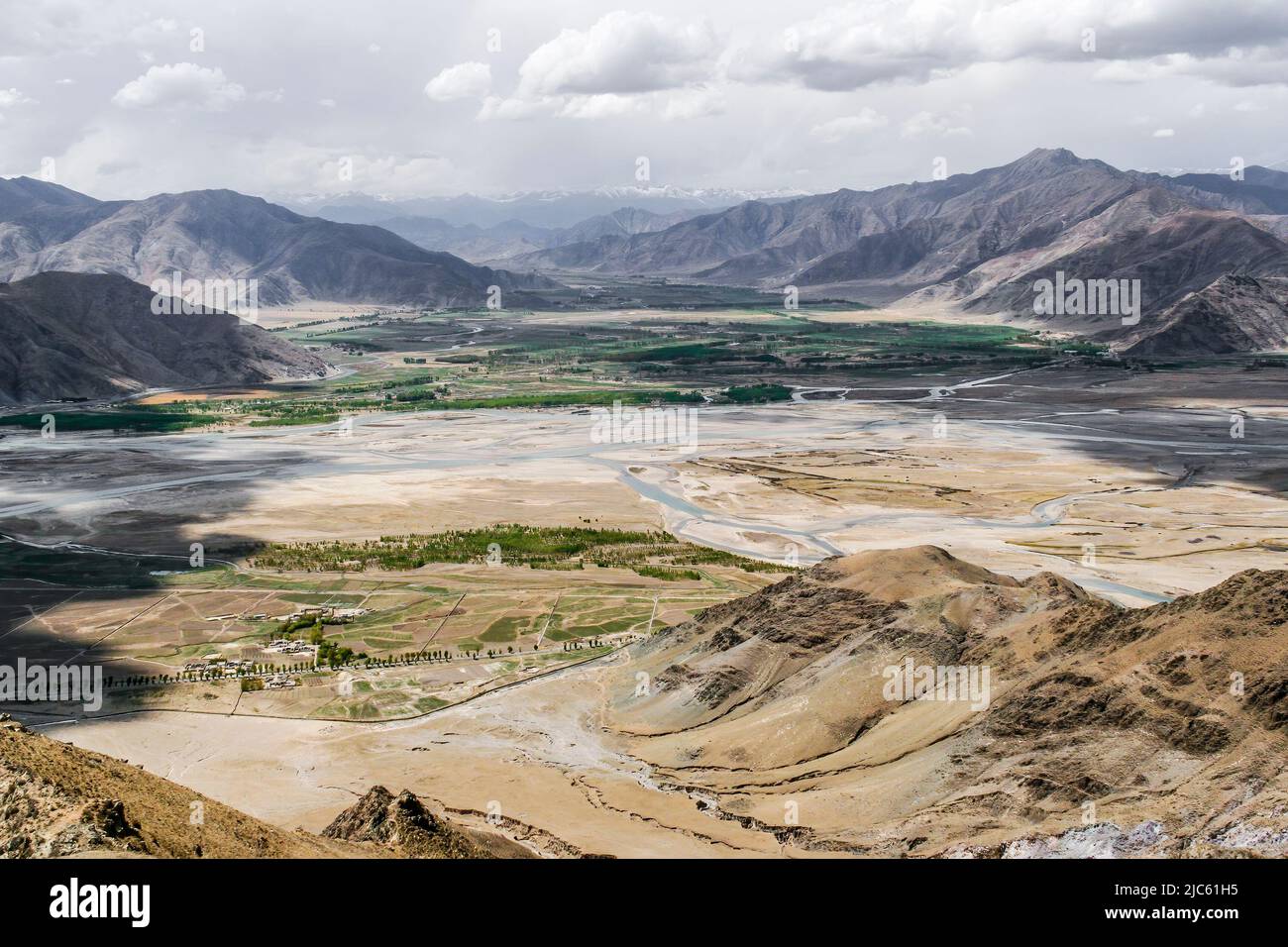 The majestic view of Lhasa Valley from the low kora pilgrimage trail at ...