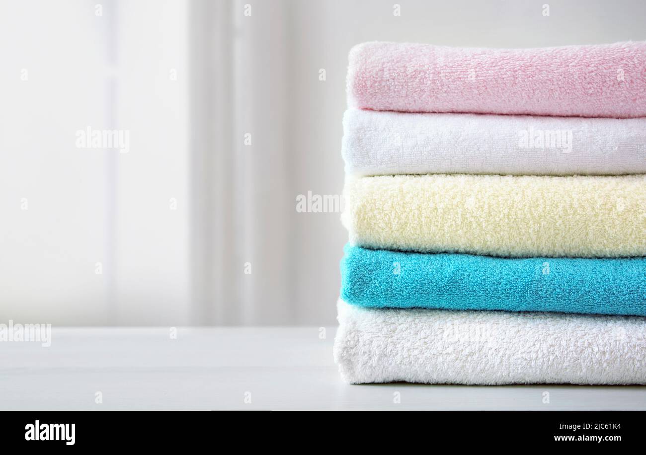 Stack of colorful terry towels empty space design. Colorful laundry ...