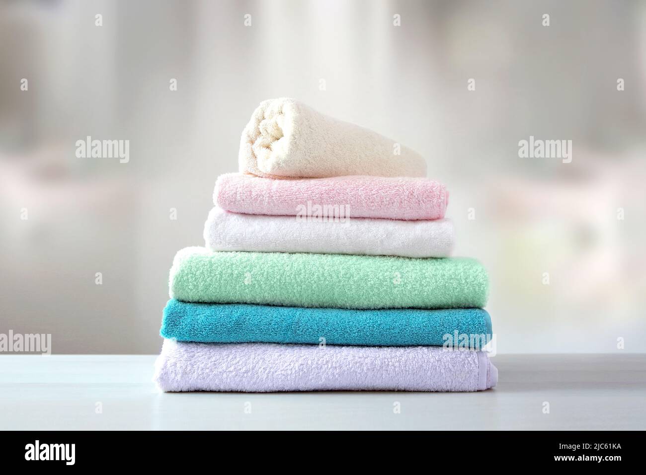Towels folded stack.Colorful linen.Household. Laundry pile.Shower items ...