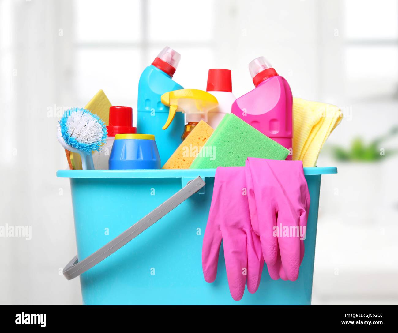 Sanitary bottles,desinfectants in plastic bucket.Housework supplies ...