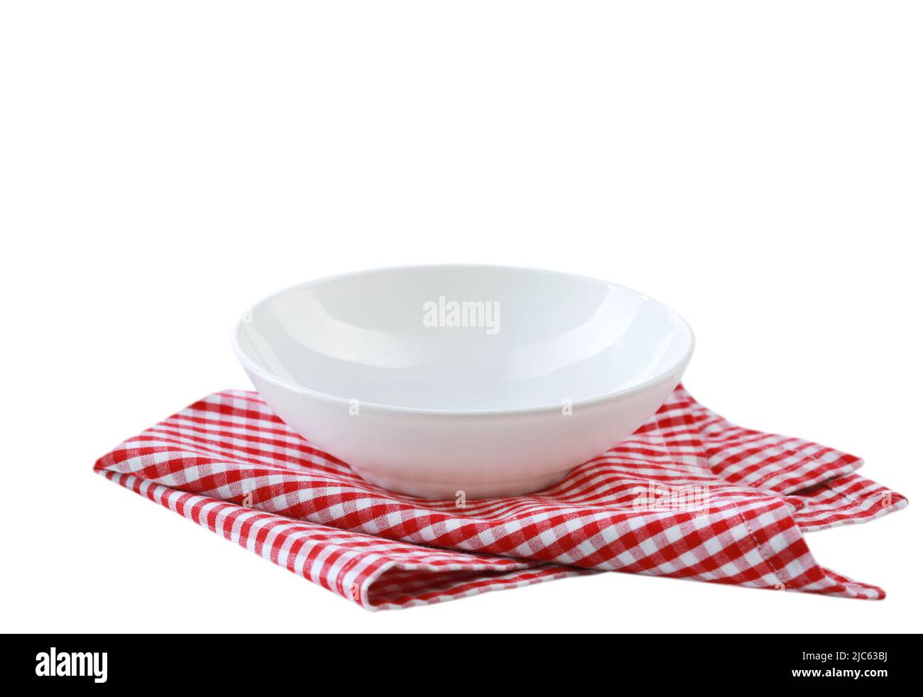 White bowl on red checkered cloth folded towel isolated.Food ...