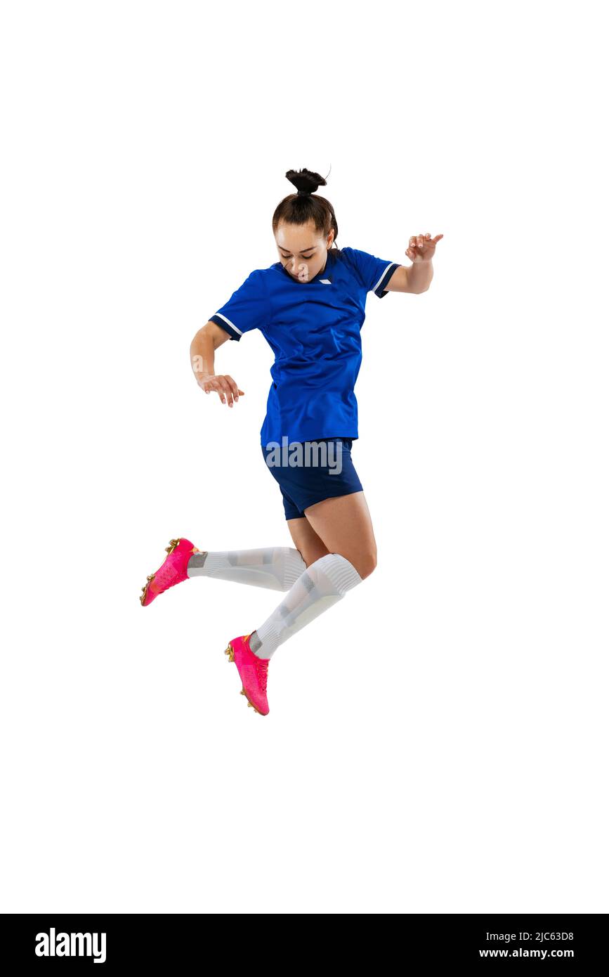 Studio shot of young female soccer, football player workout isolated on ...