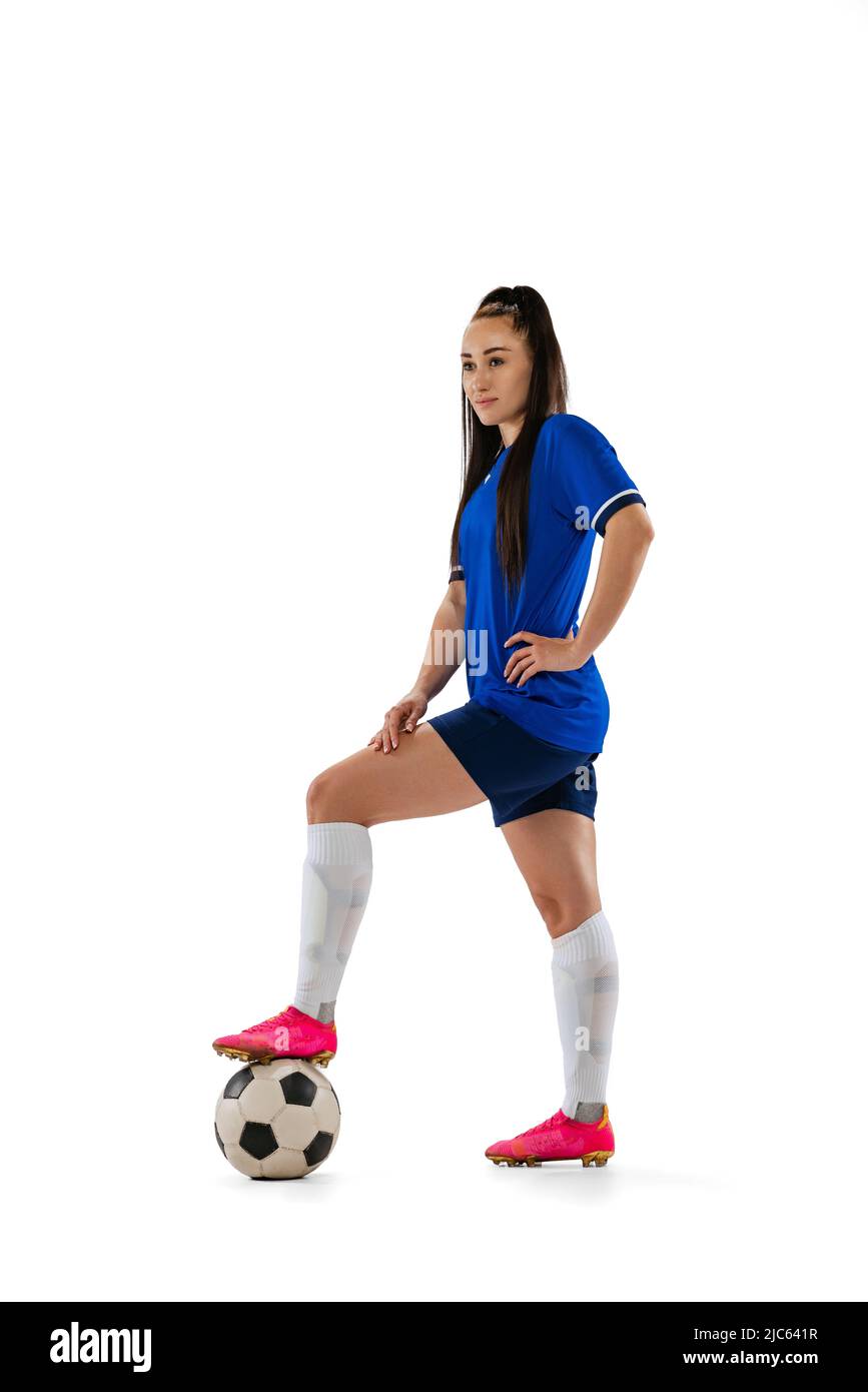 Full-length portrait of sportive girl, female soccer, football player ...