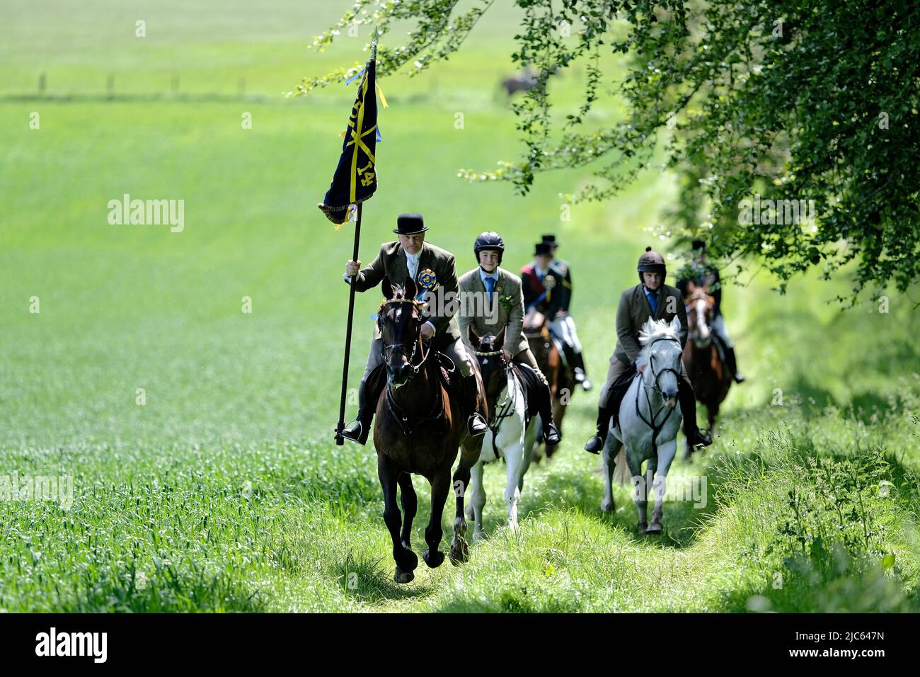 Hawick, UK. , . Acting Father, Alan Brown carrying the Bussed Banner ...