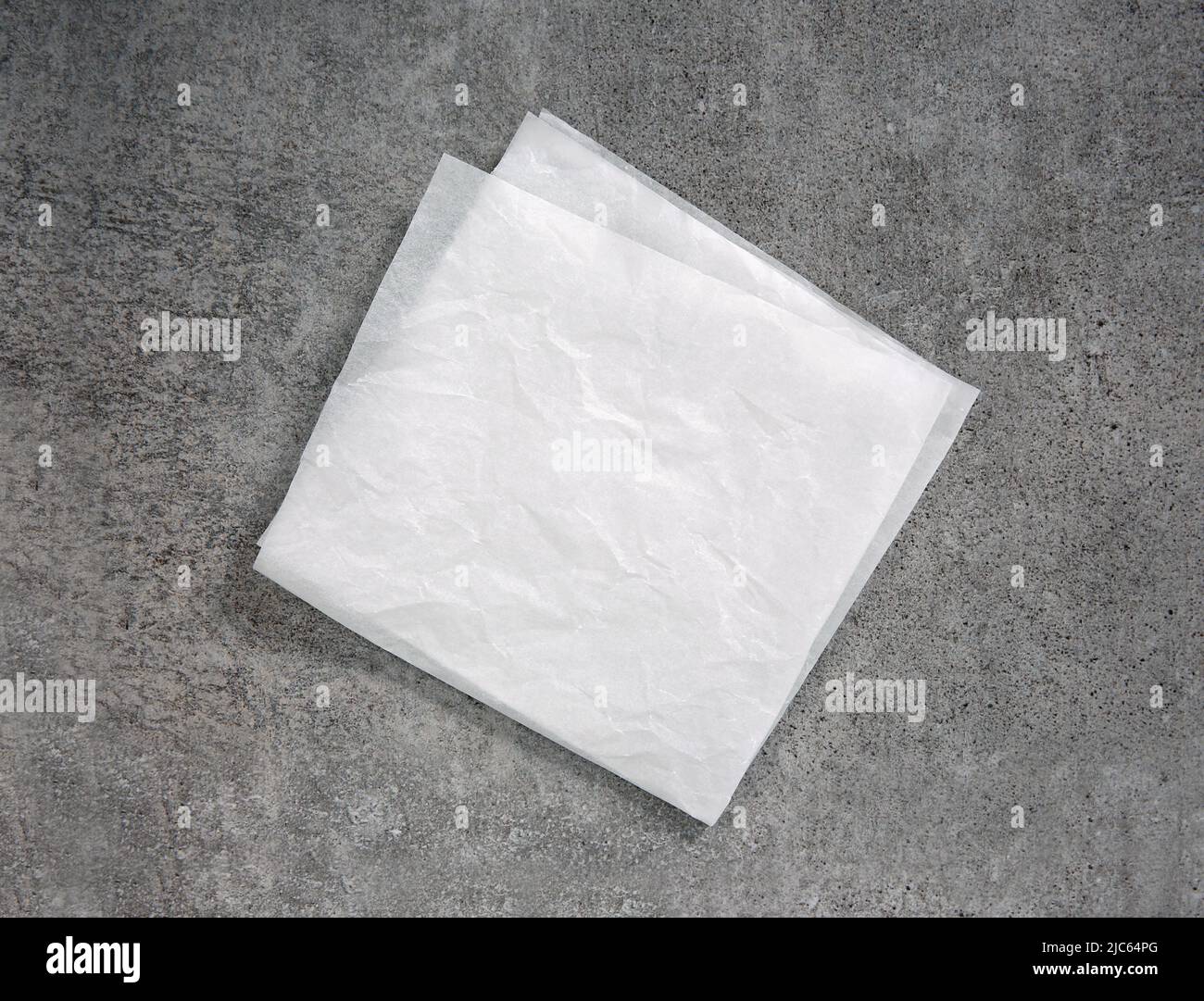 White crumpled square paper,napkin top view on grey stone table.Food ...