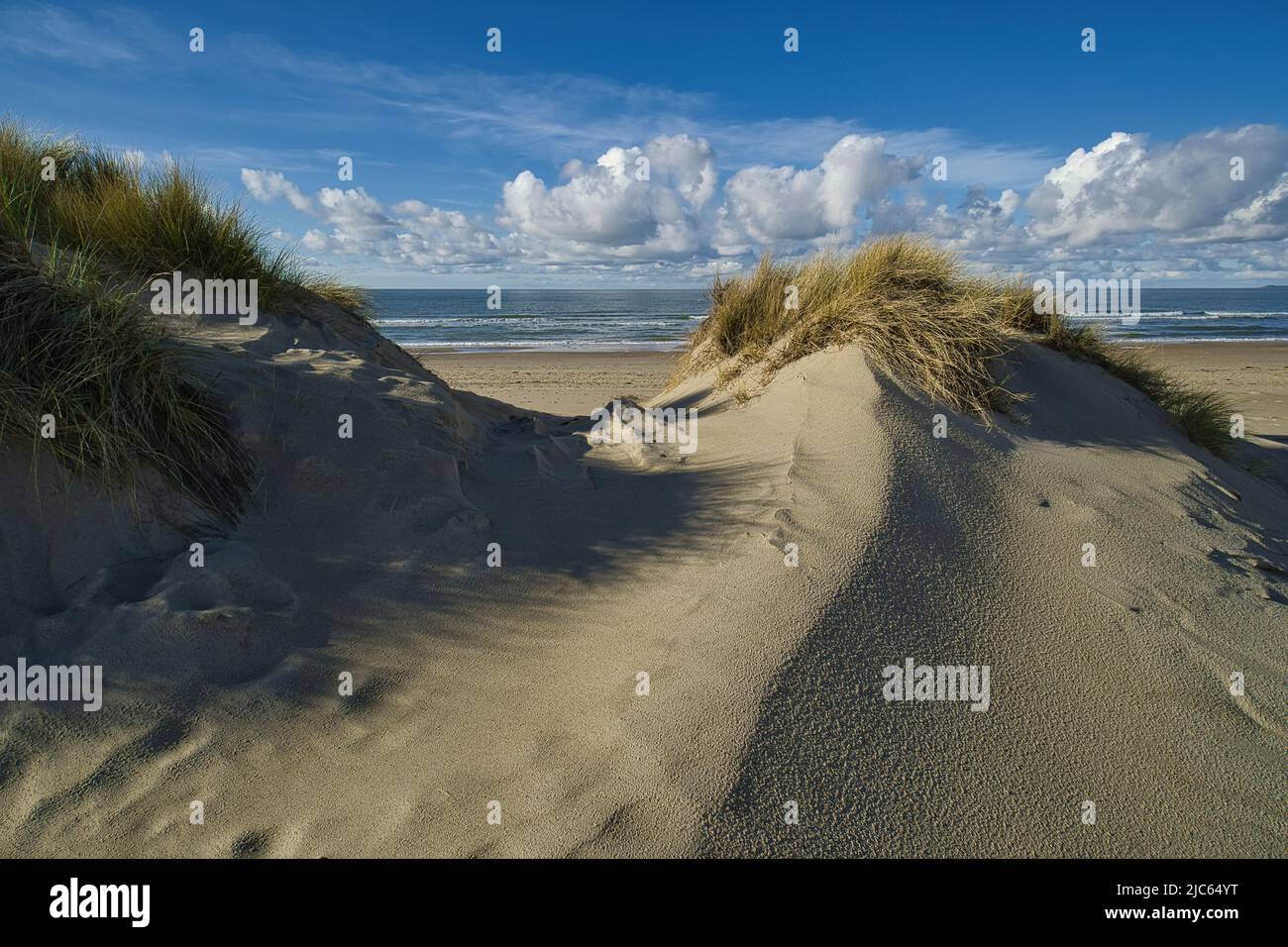 Wind formed dunes on the North Sea with beautiful cloud atmosphere ...