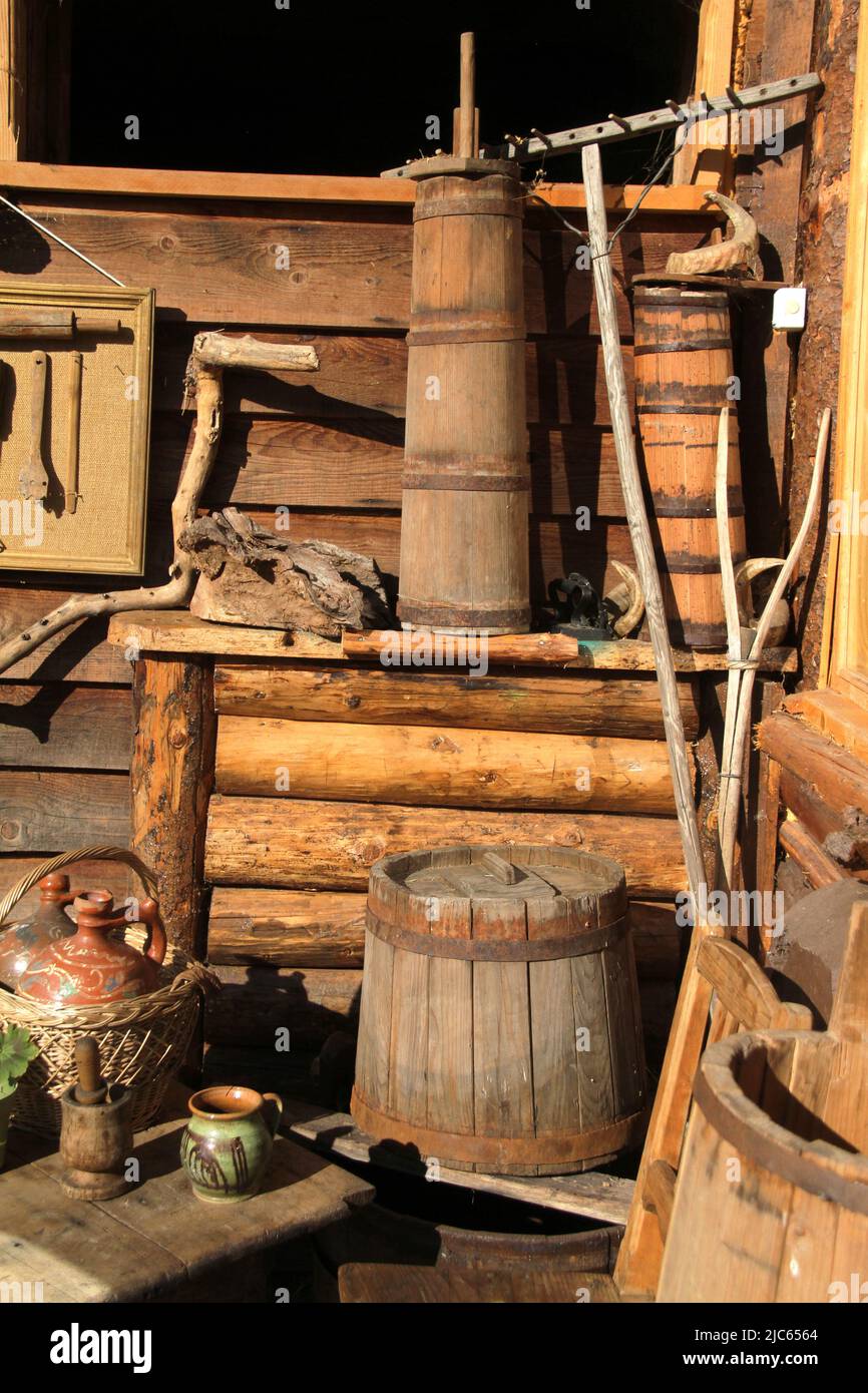 Arrangement of old traditional folk items on the exterior of a barn in ...
