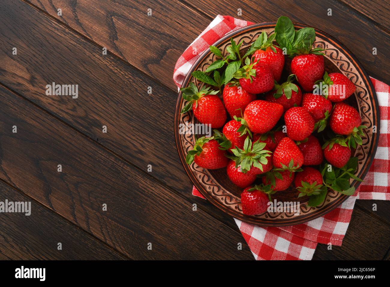 Strawberry berry. Fresh red strawberry in ceramic rustic plate in ...