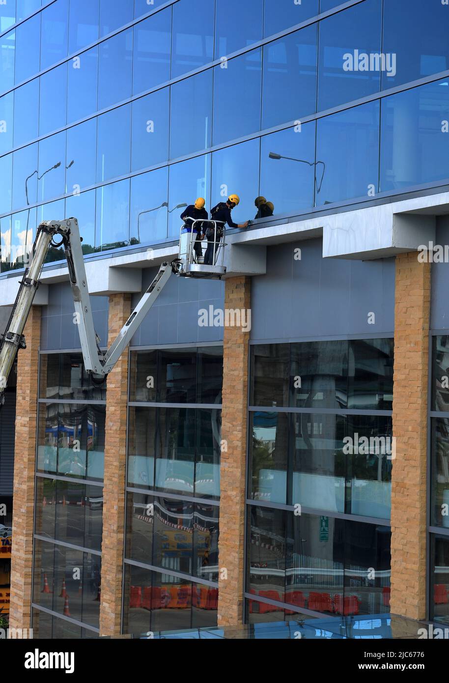 high rise building Window maintain the glass facade of a modern ...