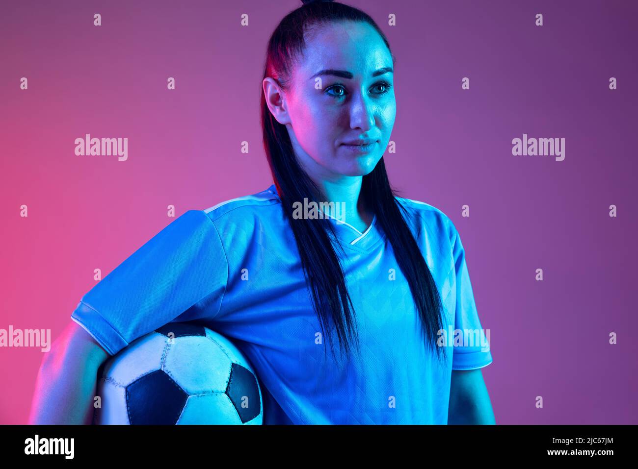 Half-length portrait of young woman, female soccer, football player ...