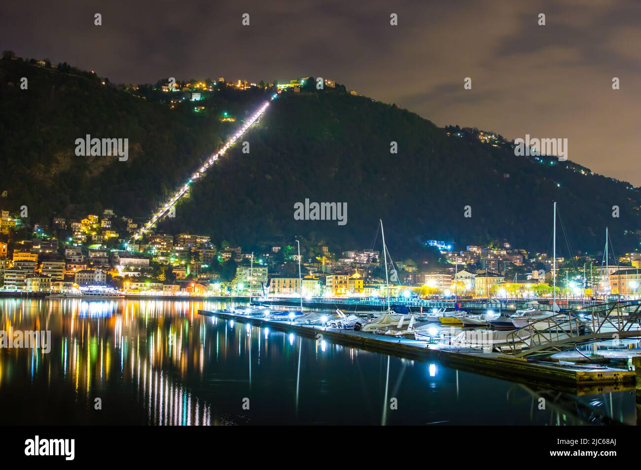 The city of Como, photographed in the evening, with the lakefront, the ...