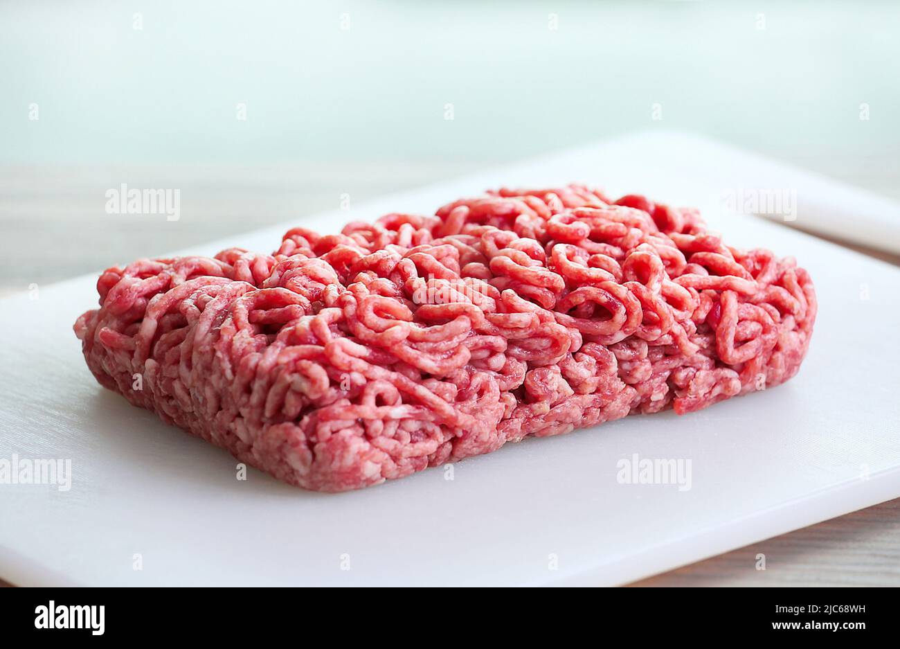 Minced meat, fresh ground beef on kitchen board.Raw food Stock Photo ...