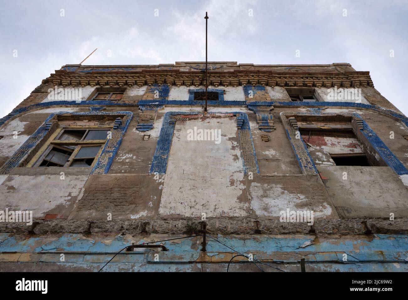Low angle view of an old abandoned building against cloudy sky Stock ...