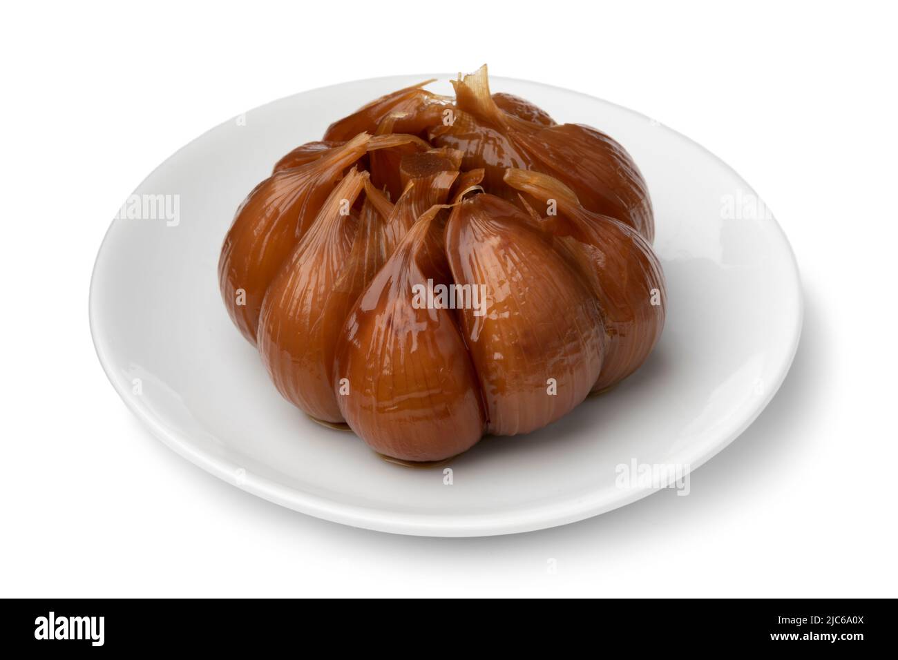 Plate with a pickled garlic bulb isolated on white background Stock ...