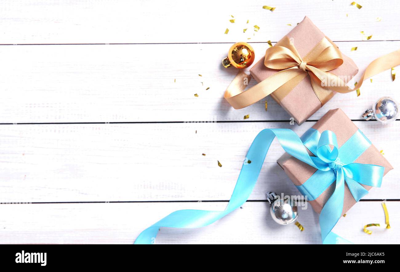 Craft paper wrapped gifts top view on wooden table.present box on ...