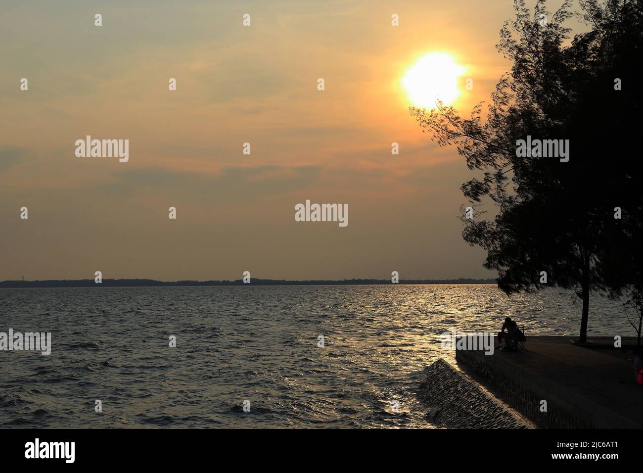 Golden sunset on the sea, Romantic Sunset scene, Lonely people at the ...