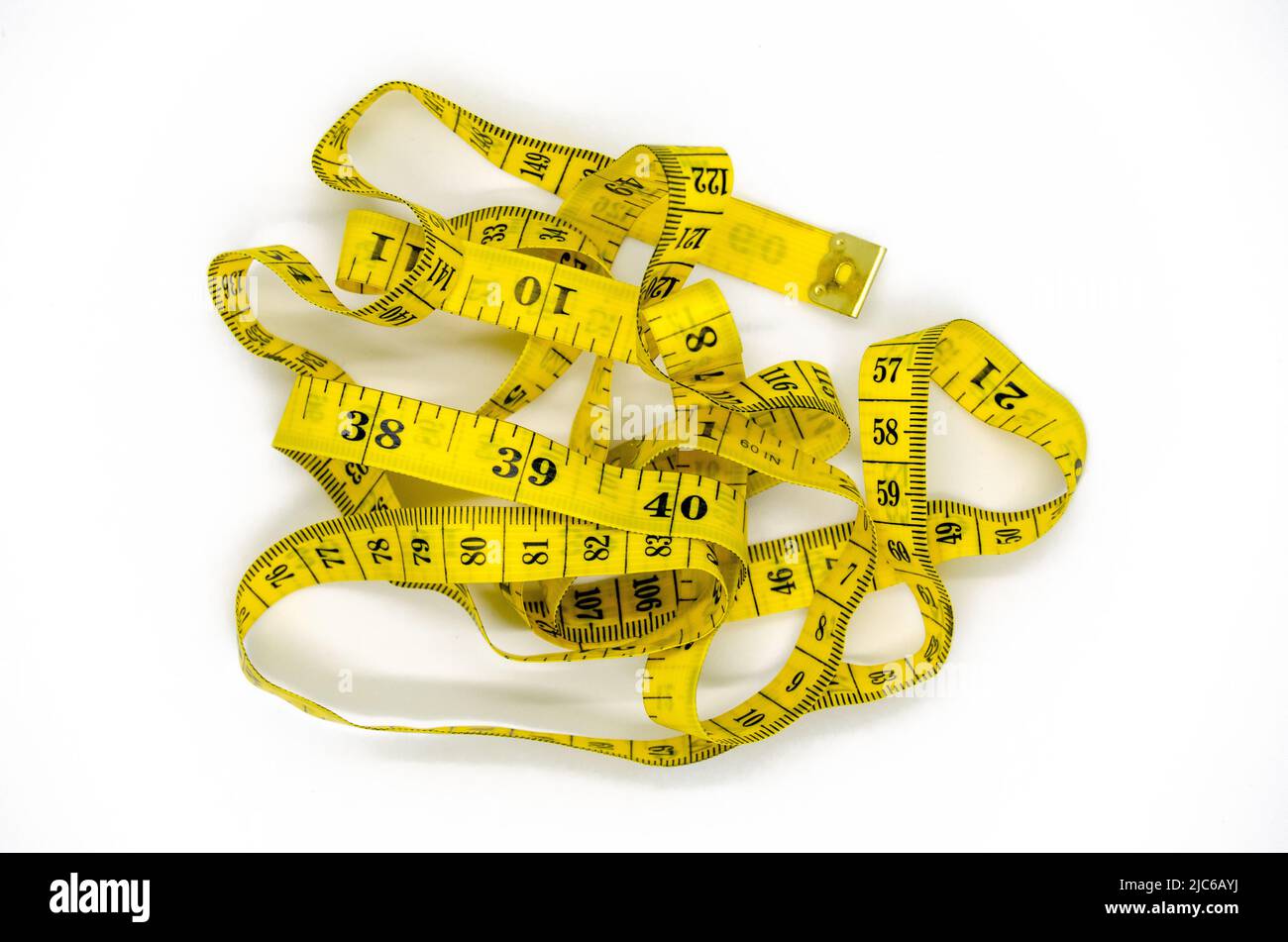 Isolated yellow tape metric - inch measure on white background, top ...