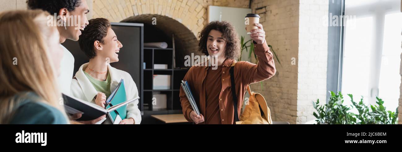 Positive interracial friends toasting hi-res stock photography and ...