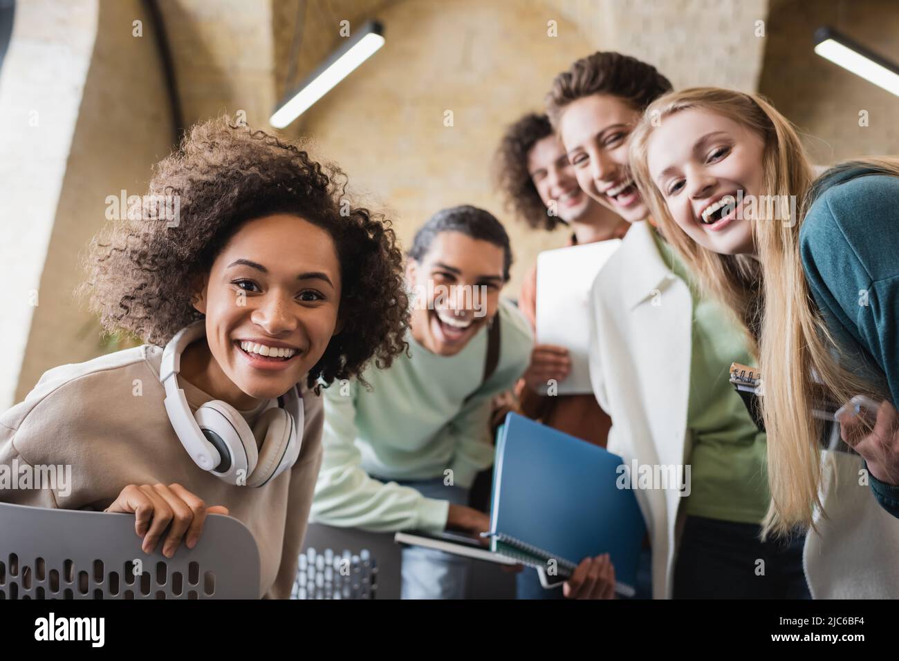 Cheerful multicultural young students looking hi-res stock photography ...
