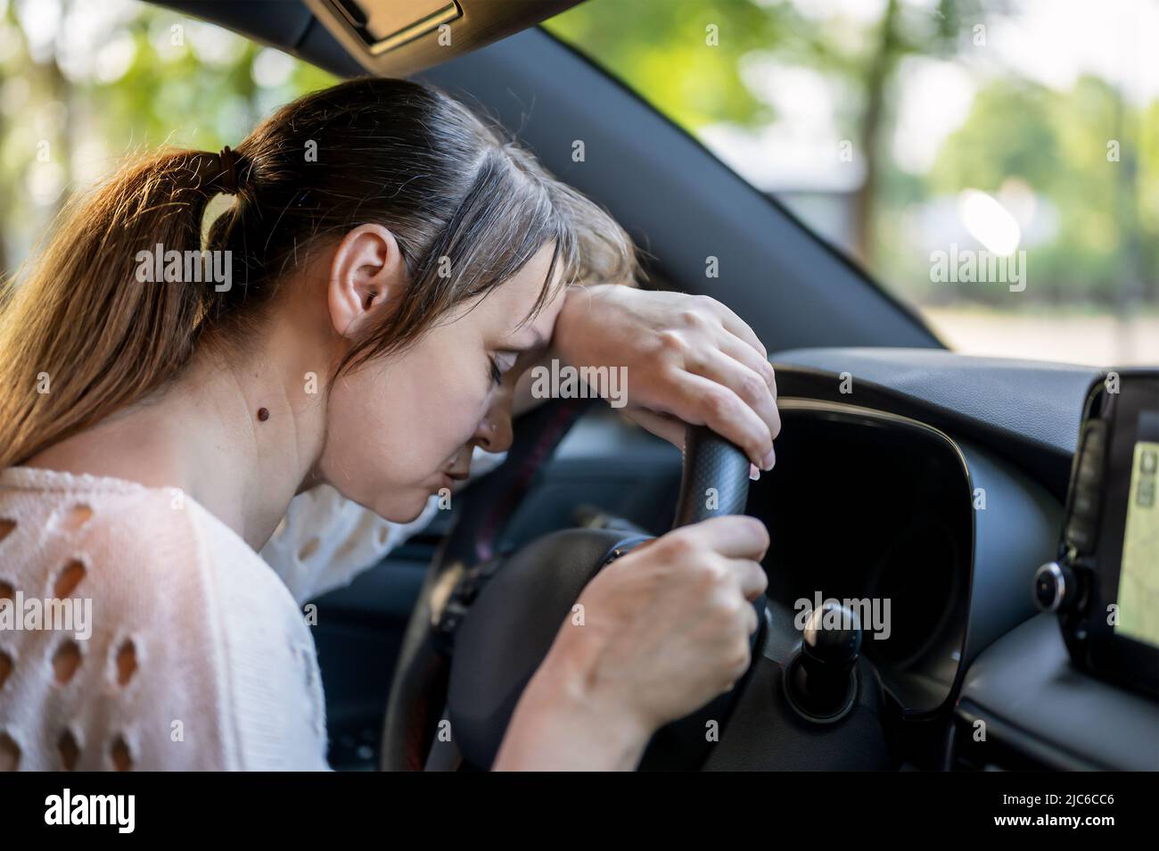 stop in traffic jam and breakdown on the road. Tired sad woman with ...