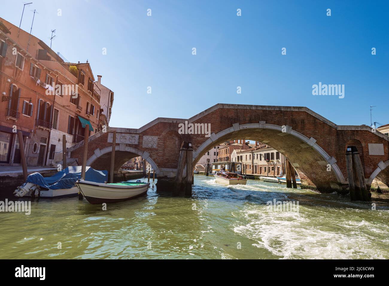 Venice. Bridge of the Three Arches (Ponte dei Tre Archi), made of brick ...