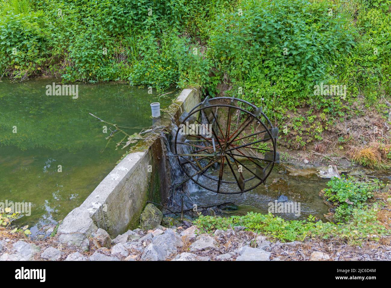 Rotating Water Wheel at Small River Stream Stock Photo - Alamy