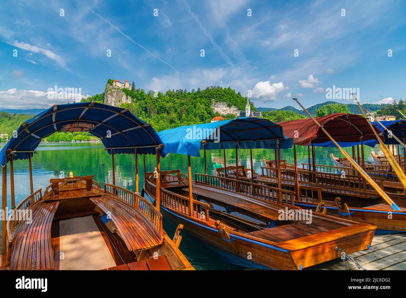 Traditional Pletna boat on the Bled lake. In the background is the ...