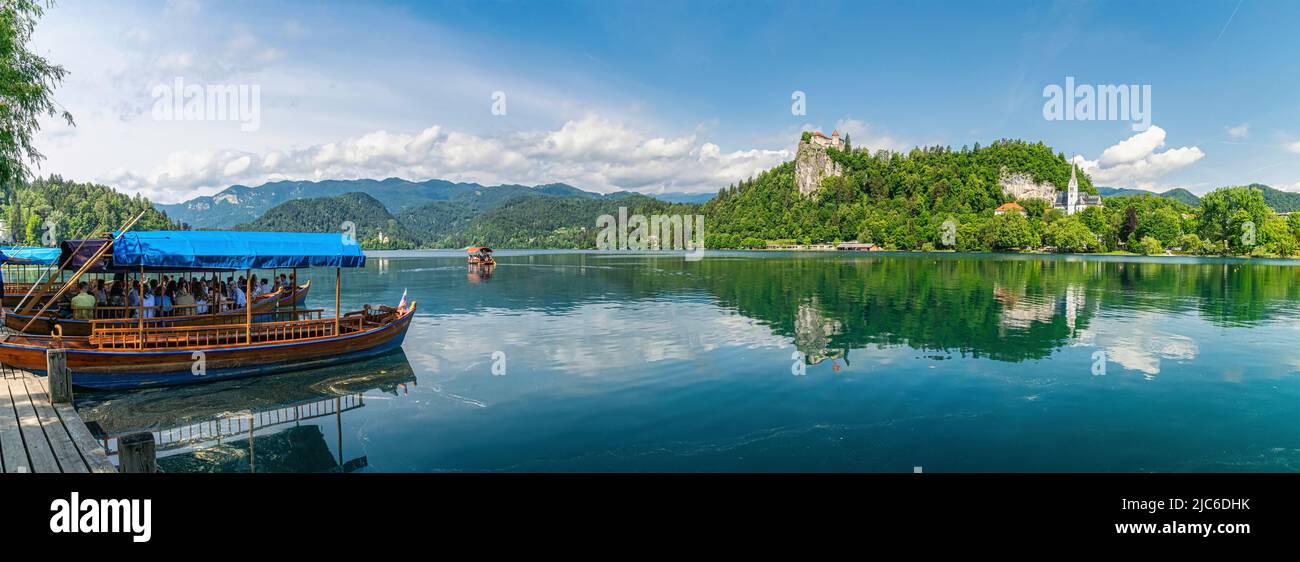 Traditional Pletna boat on the Bled lake. A boat that transports ...
