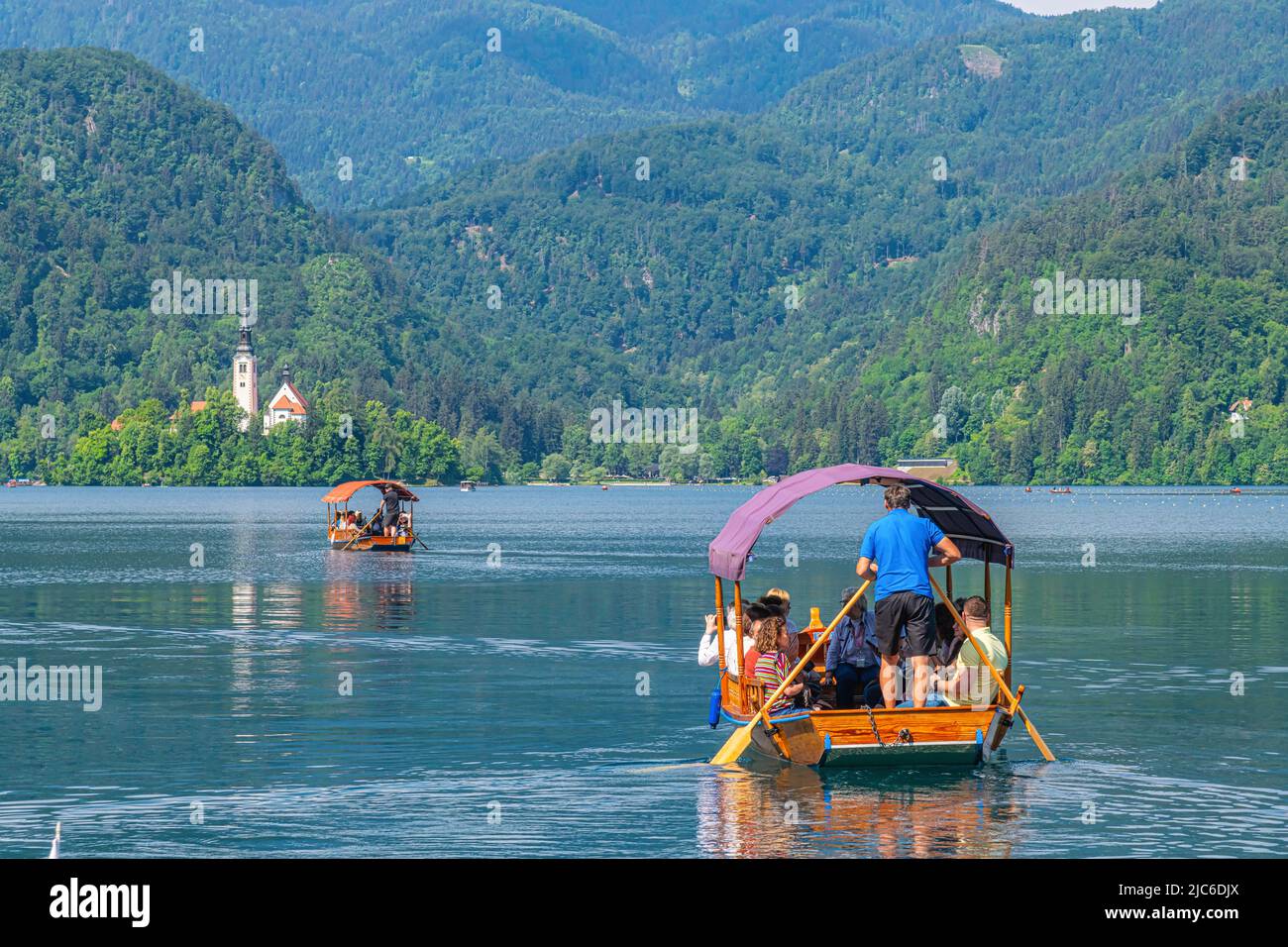Traditional Pletna boat on the Bled lake. A boat that transports ...