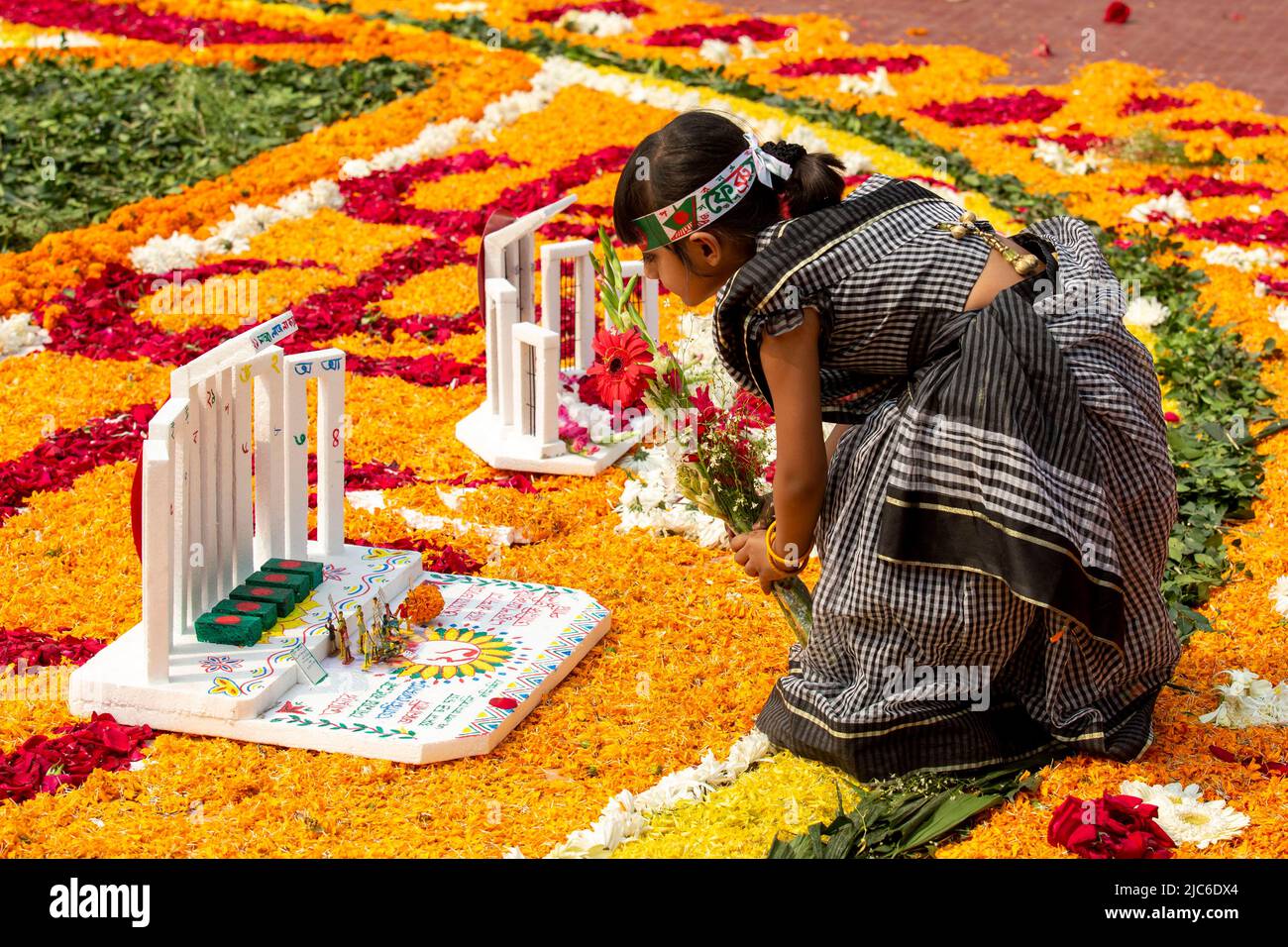 A girl child pays homage to the martyrs of Language Movement in 1952 ...