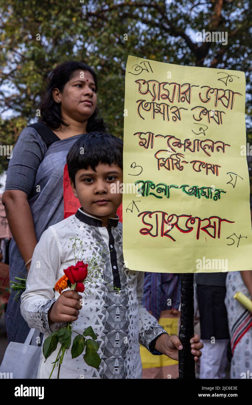A crowd marches through the street to commemorate the sacrifices of the ...
