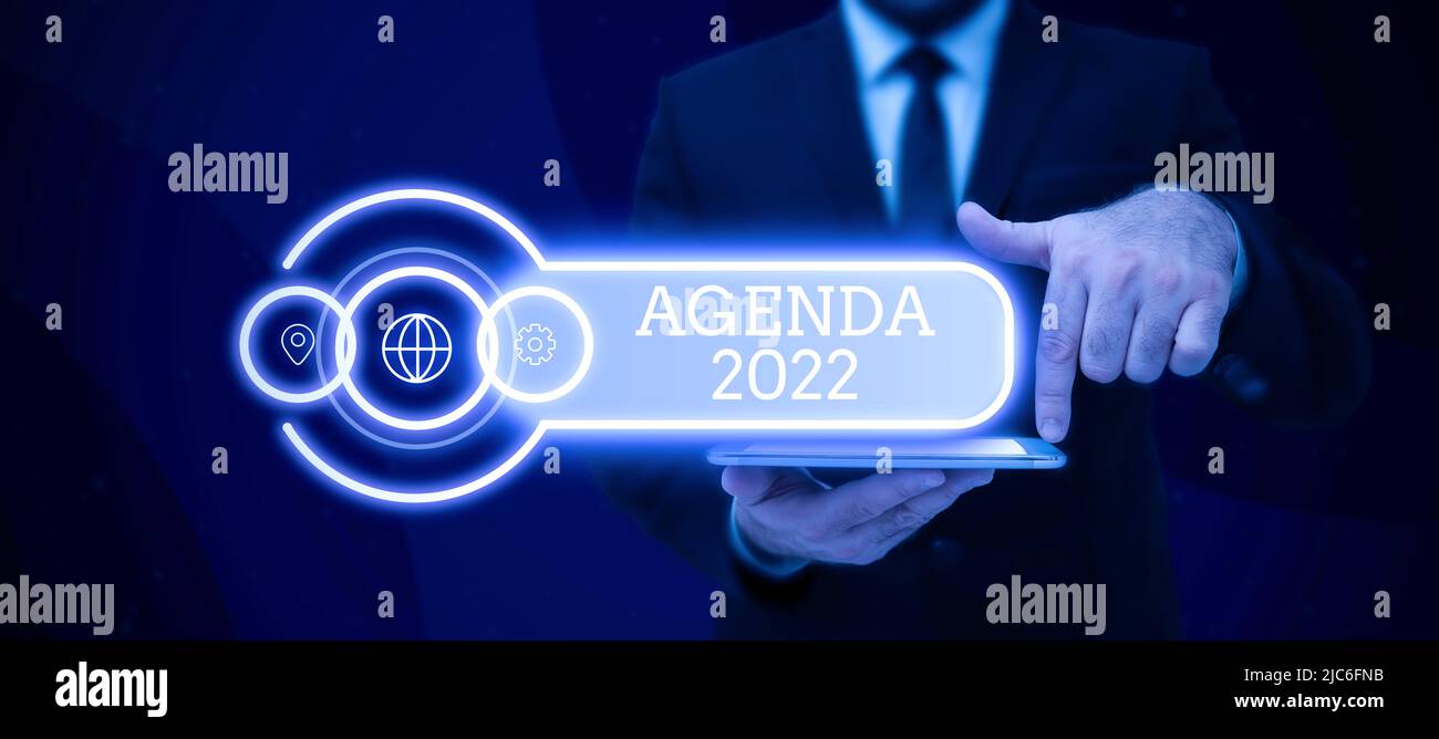 Text caption presenting Agenda 2022. Word Written on list of activities ... Text caption presenting Agenda 2022. Word Written on list of activities ...