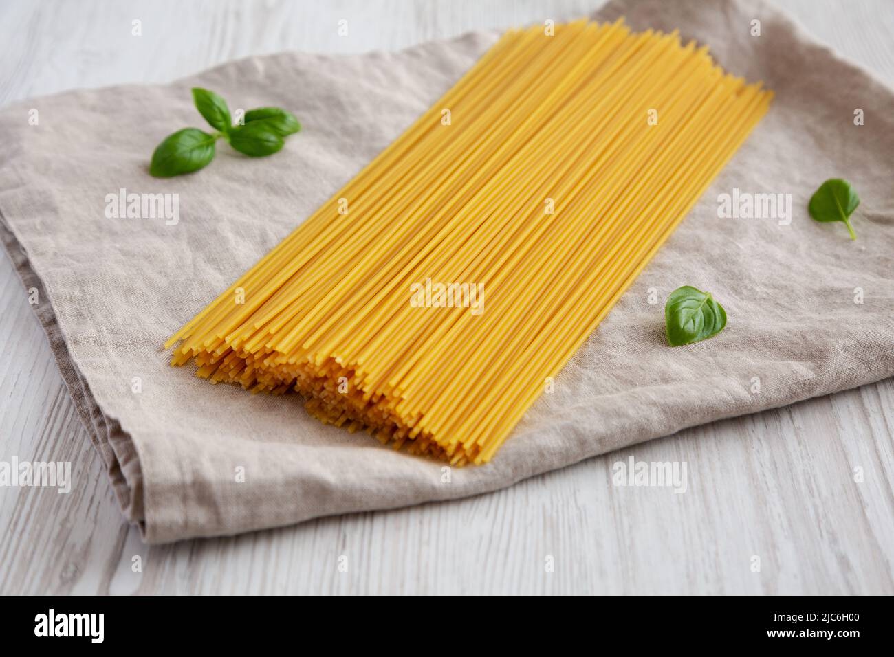 Raw Organic Spaghetti Pasta in a Bunch, side view Stock Photo - Alamy