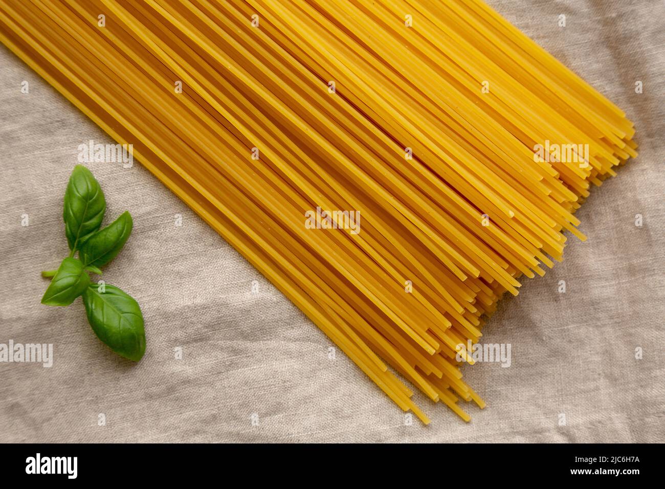 Raw Organic Spaghetti Pasta in a Bunch, top view. Flat lay, from above ...