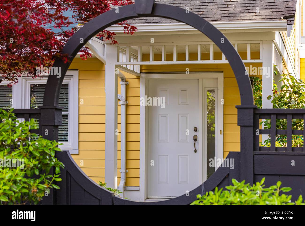 Round entrance gate. Entrance of a typical townhouse with a patio in ...