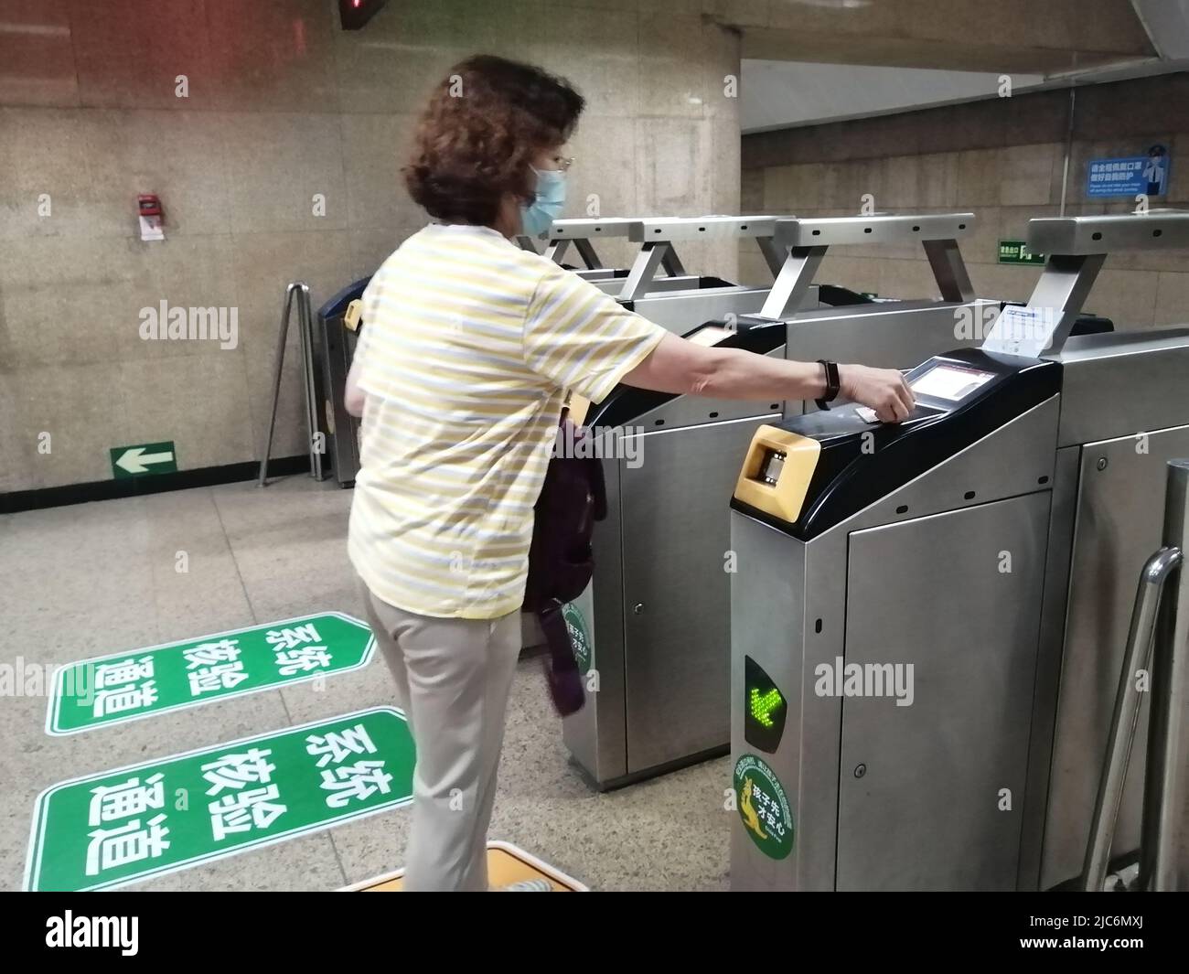BEIJING, CHINA - JUNE 9, 2022 - Passengers swipe their cards to pass ...