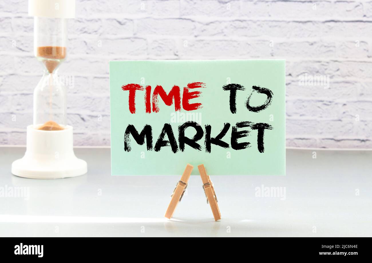 Notepad with text Time To Invest on Market charts and pen Stock Photo ...