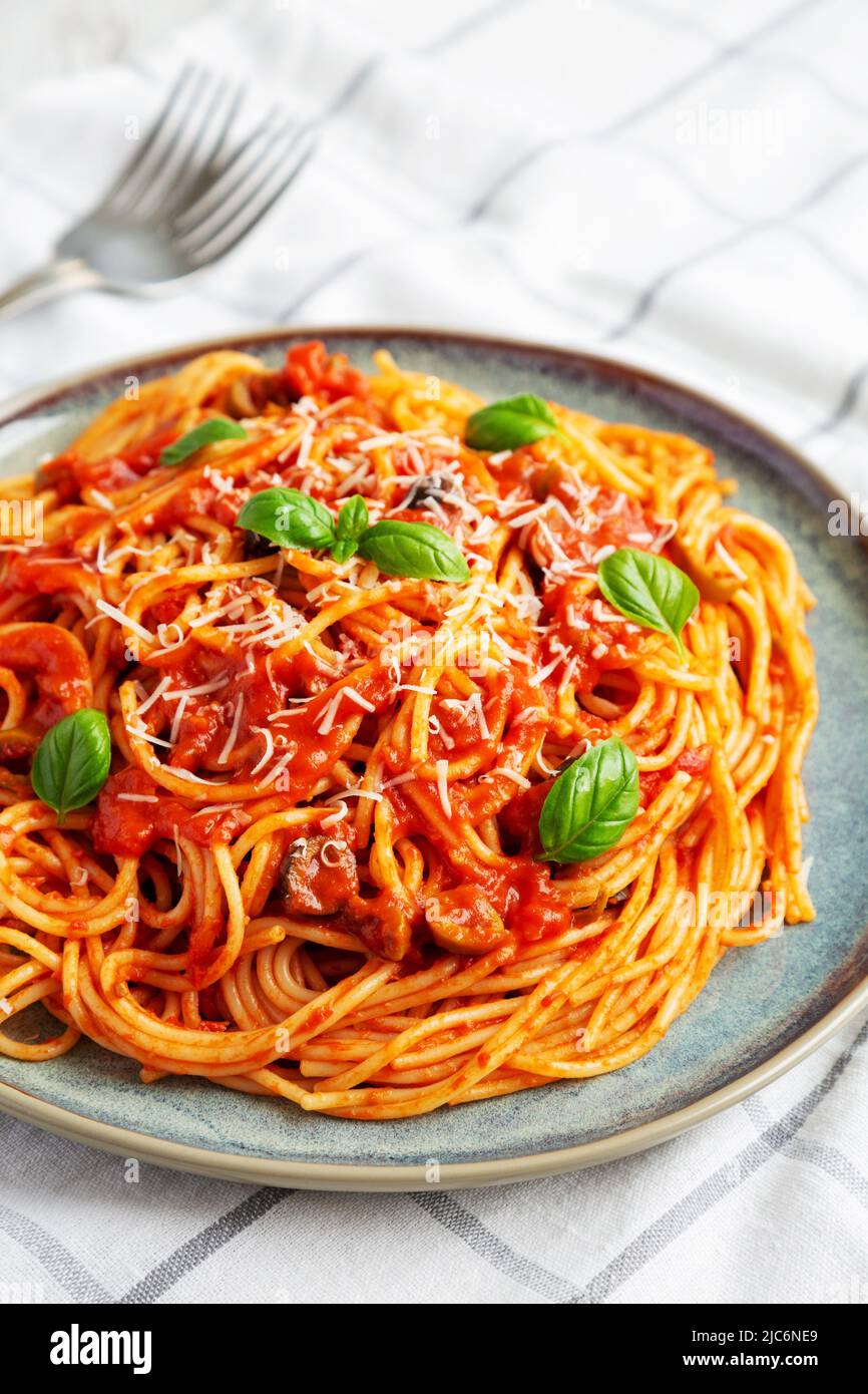 Homemade Spaghetti with Olives and Tomato Sauce, side view Stock Photo ...