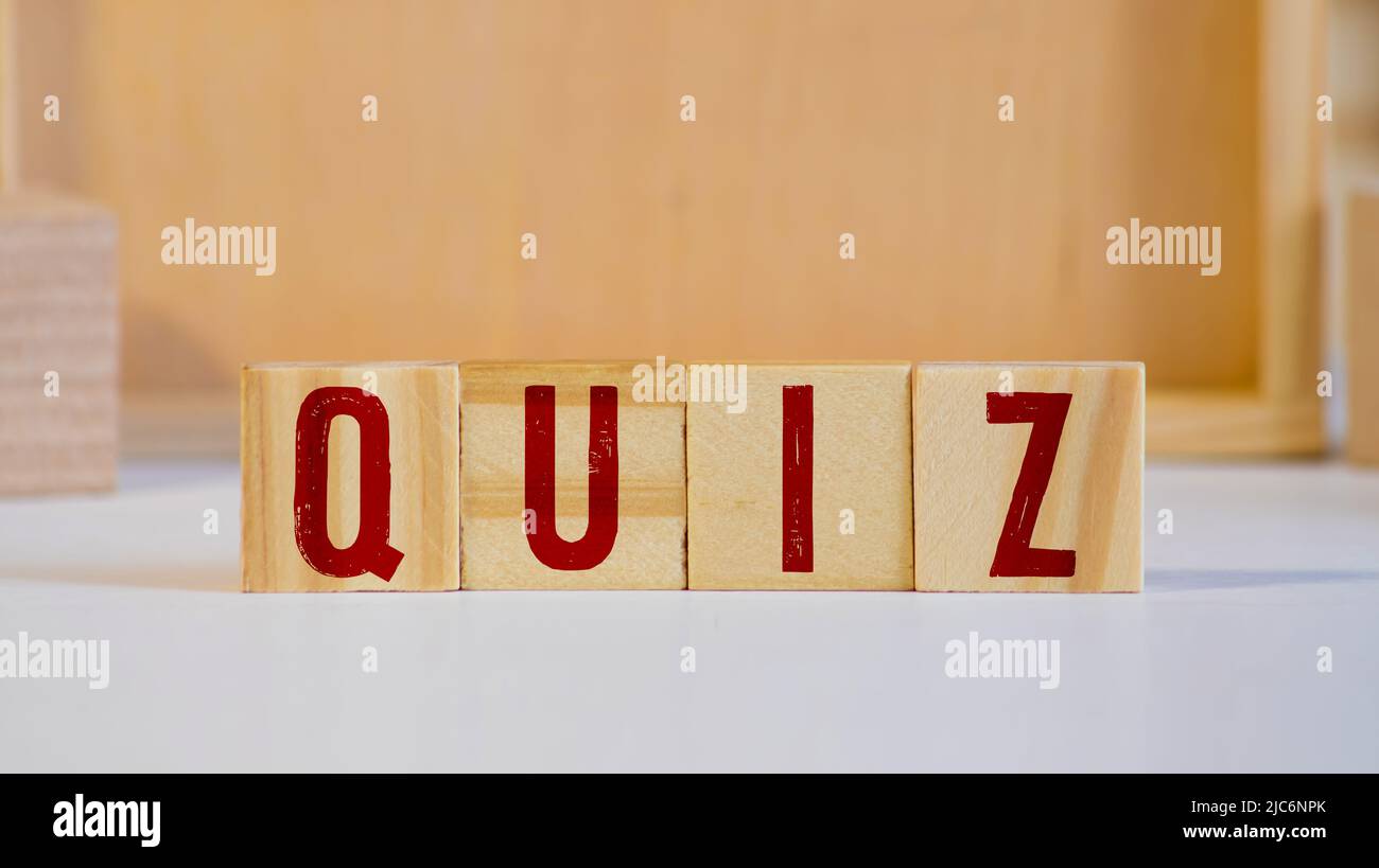 QUIZ. Wooden cube block building the word QUIZ Stock Photo - Alamy